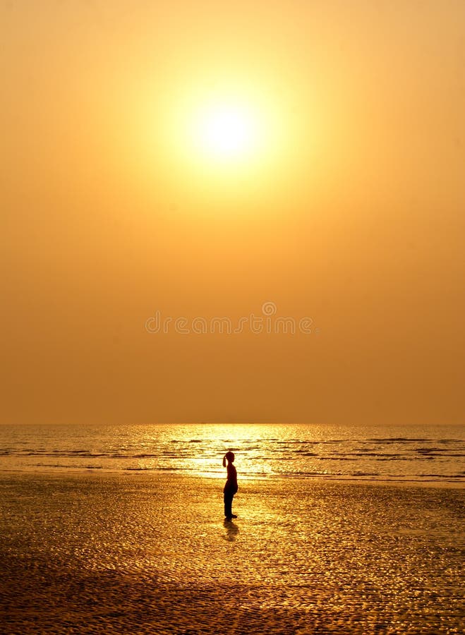 A Small Girl Silhouetted Against Sun Set Stock Photo - Image of dark ...