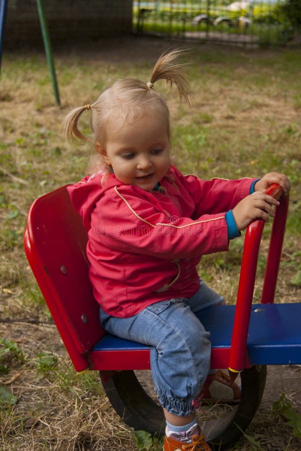 Small Girl Smiling on the Seesaw Stock Photo - Image of design, small ...