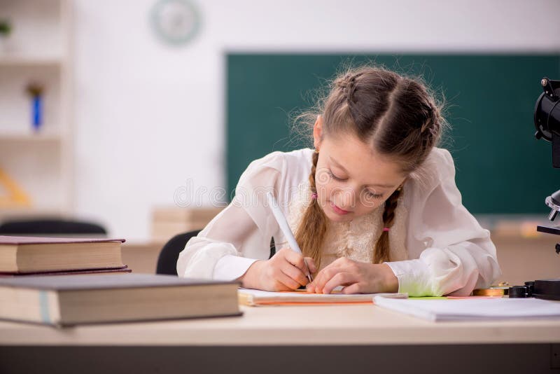 Small Girl Studying in the Classroom Stock Image - Image of chemist ...