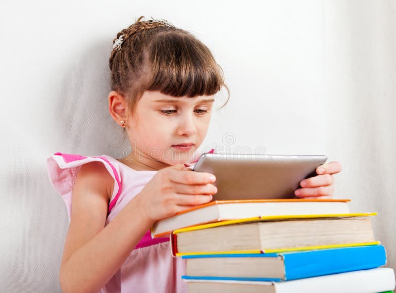 Small Girl with Tablet Computer Stock Photo - Image of face, device ...