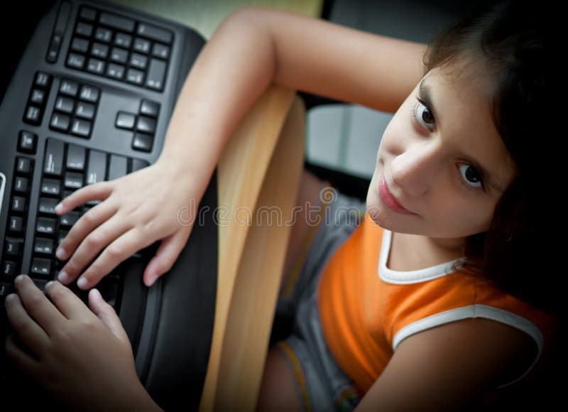 Small Girl Working with a Computer at Home Stock Photo - Image of ...