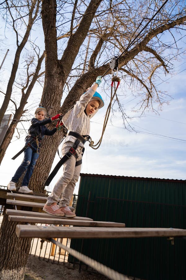 Small Girls Climb in Rope Park in the Spring Stock Image - Image of ...