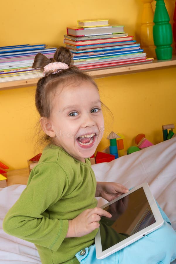 Small girls with tablet stock image. Image of screen - 36756641