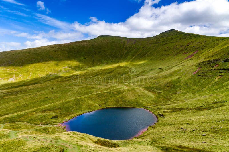 Small Glacial Formed Lake Beneath Higher Mountains Stock Image - Image ...