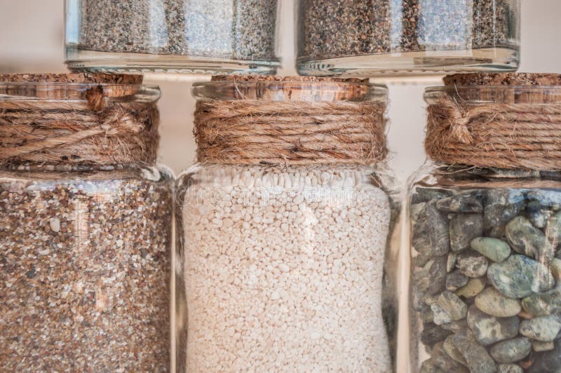 Small Glass Bottles with Sand and Rocks Stock Photo - Image of outdoors ...