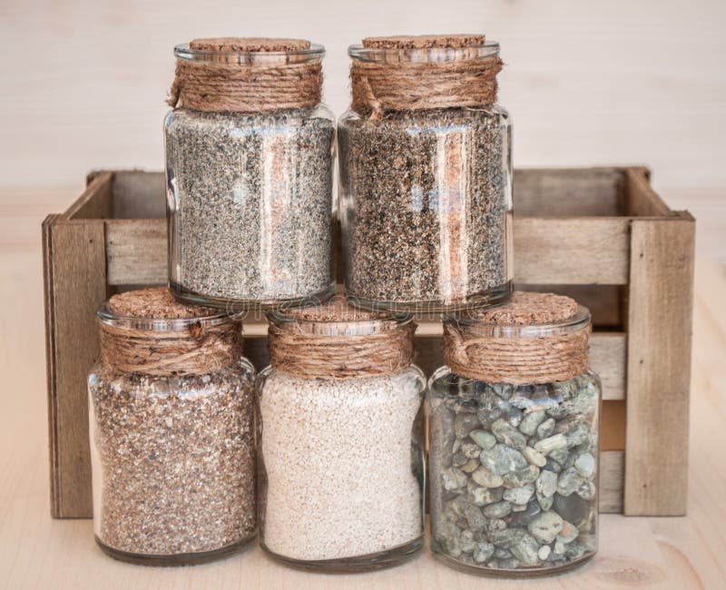 Small Glass Bottles with Sand and Rocks Stock Photo - Image of tropical ...