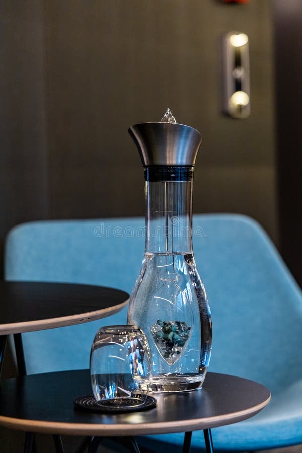 Small Glass Carafe Full of Water with Blue and White Crystals and Glass ...