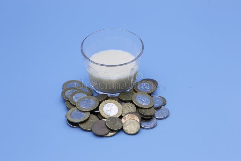 Small Glass of Milk with Coins Around Stock Image - Image of dairy ...