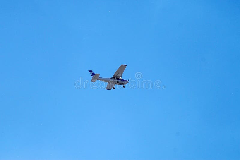 A Small Glider Flies in a Clear Blue Sky, Close-up Editorial Stock ...