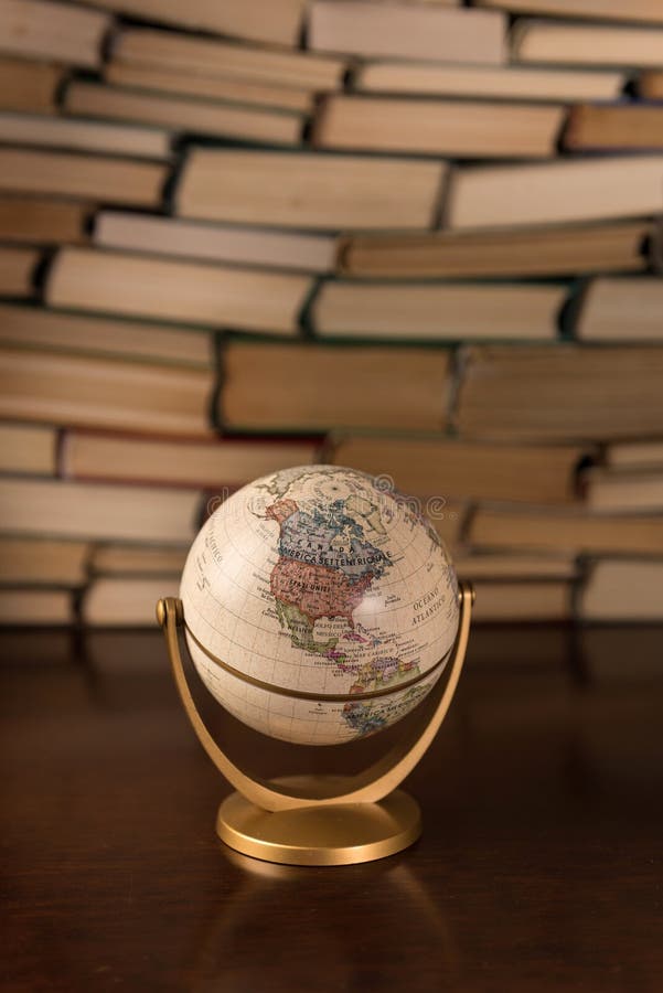 Small Globe And Many Books On A Wooden Table Stock Image - Image of ...