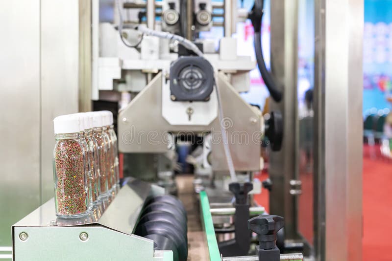 Small Grain Like Product in Clear Bottle Glass are Placed Arrange Row ...