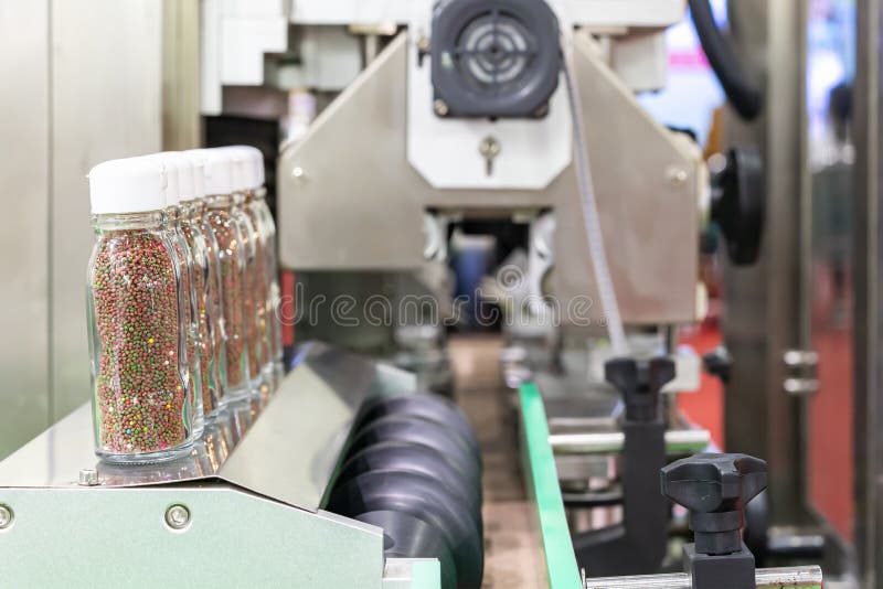 Small Grain Like Product in Transparent Bottle Glass are Placed Arrange ...