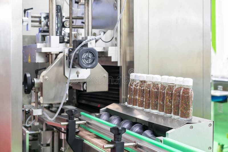 Small Grain Like Product in Transparent Bottle Glass are Placed Arrange ...