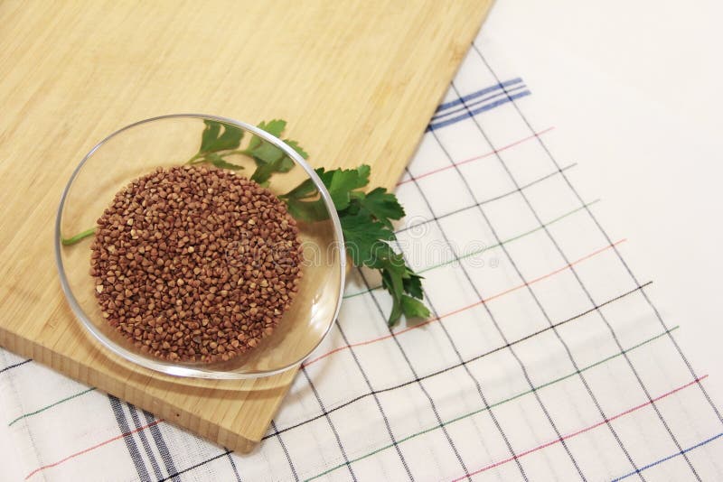 Small Grains of Natural Brown Buckwheat in a Transparent Plate on a ...