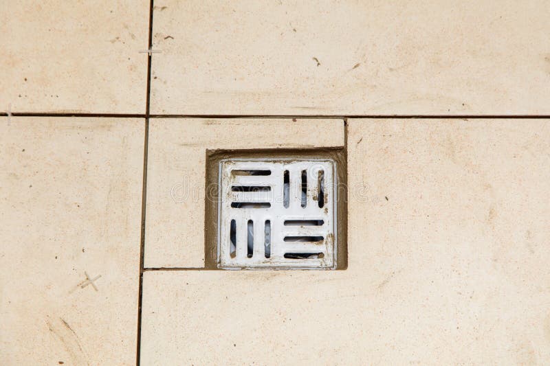A Small Grate is Visible on a Tile Floor Stock Photo - Image of hole ...