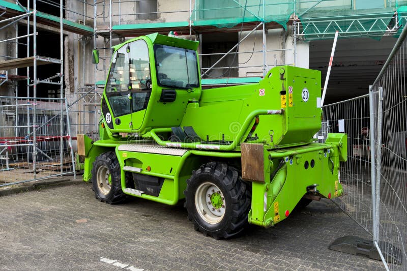 Small Green Construction Equipment Against Background Building Stock ...