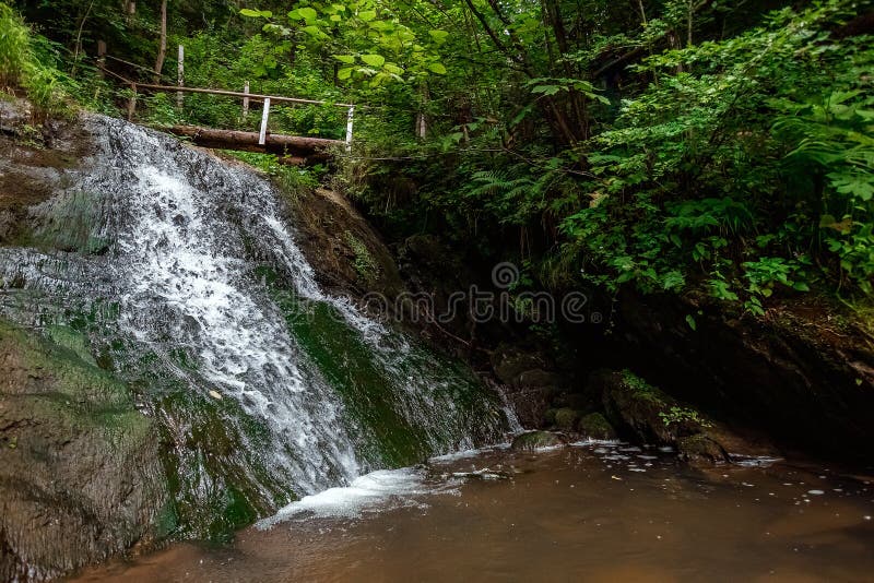 Small Green Forest Waterfall in the Cave Mountains, Cascades on a ...