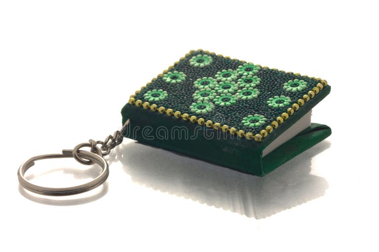 Small green key-ring book stock image. Image of trinket - 7578579