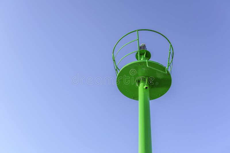 A Small Green Lighthouse on the Waterfront. Stock Photo - Image of ...