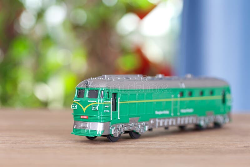 A Small Green Train Model on the Table Stock Image - Image of races ...