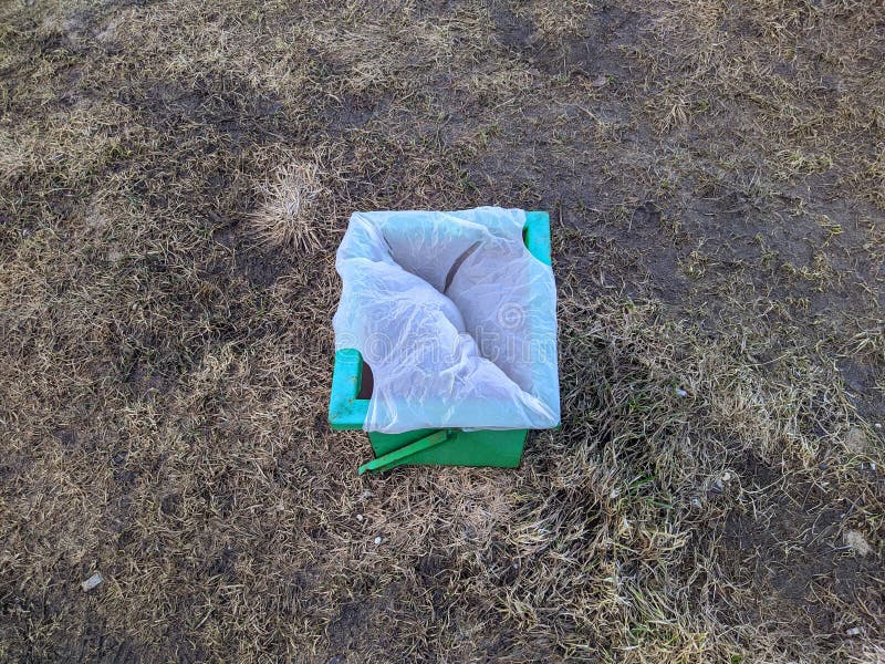 Small and Green Trash Can in the Park Stock Photo - Image of green ...