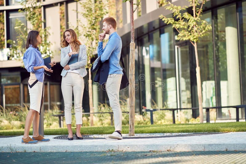 Small Group of Coworkers Socialising Outdoors Stock Image - Image of ...