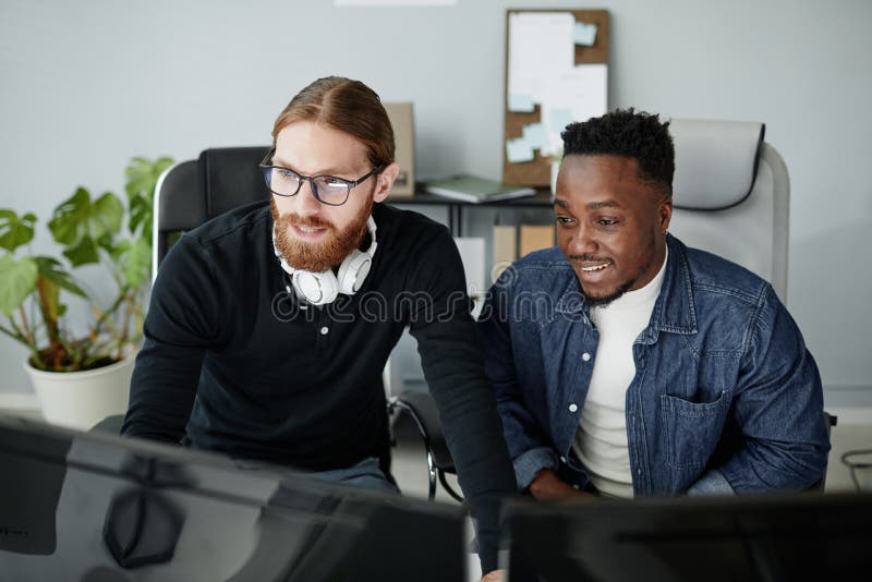 Small Group of Diversity Programmers Working in Front of Computer ...