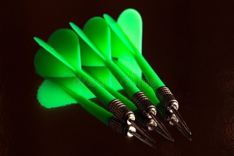 Small Group of Green Darts and it Reflection Stock Photo - Image of ...