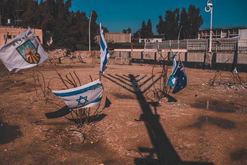 A Small Group of Israeli Flags on a Barren Surface with Other Flags and ...