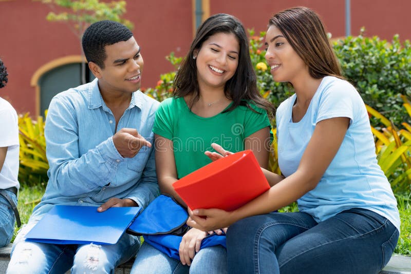 Small Group of Learning and Talking Latin American and Caucasian ...