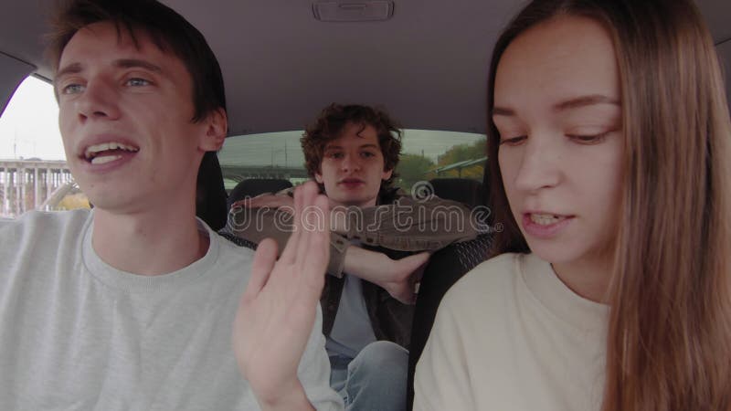 A Small Group of People is Riding in a Car. People are Driving in a Car ...