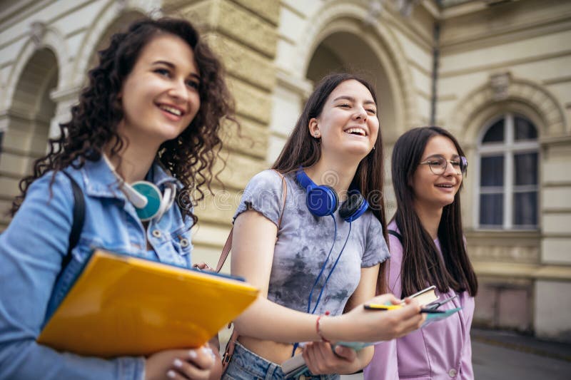 Students Studying Outside of Their Campus and Talking about School ...