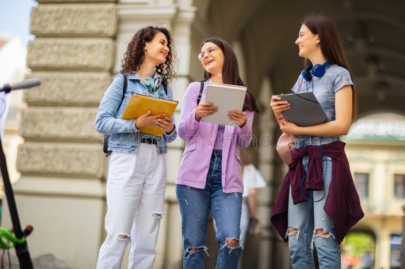 Group of Students Studying Outside of Their Campus and Talking about ...