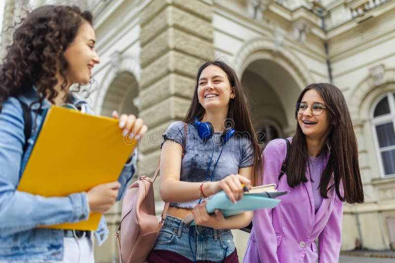 Group of Students Studying Outside of Their Campus and Talking about ...
