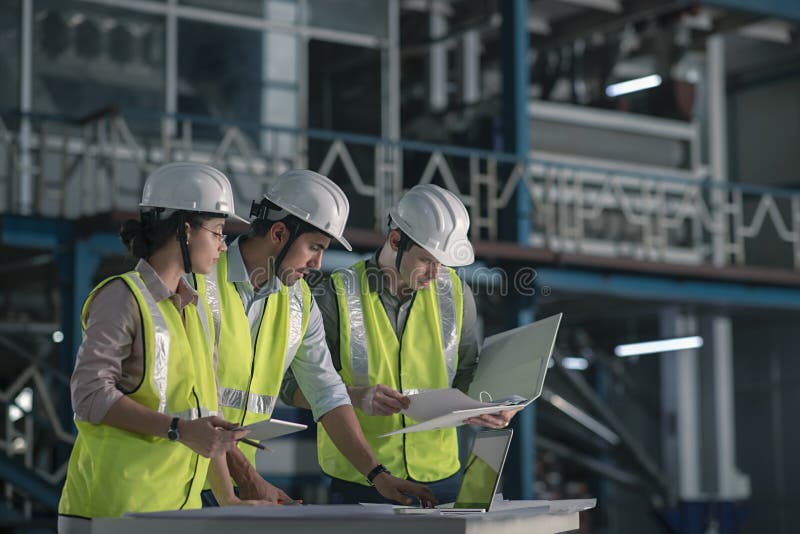 Small Group of Technical Engineers Working in the Factory Stock Image ...