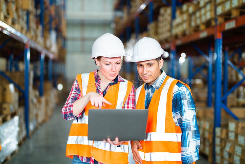 Workers in Distribution Warehouse Stock Image - Image of asian, loading ...