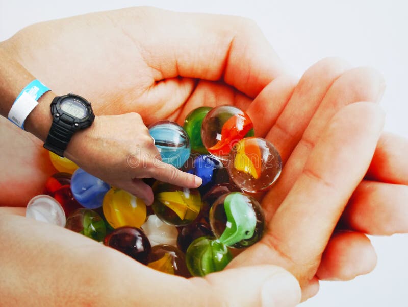 Small Hand Giant Marbles stock photo. Image of color - 83474322