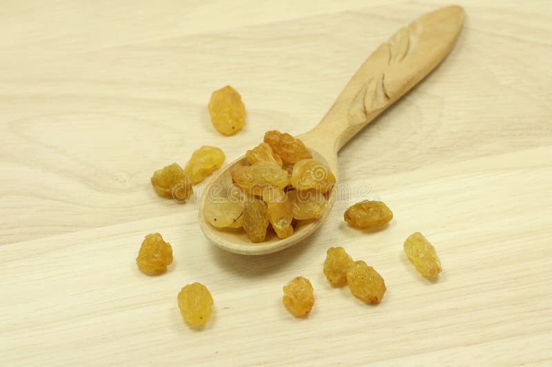 Small Handful of Raisins in a Wooden Spoon Stock Image - Image of spoon ...