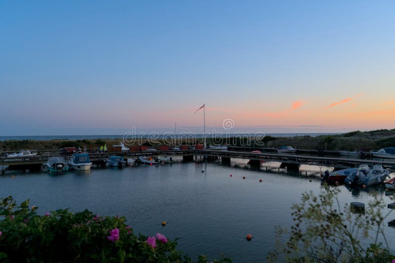A Small Harbour with Boats and Tiny Houses in the Evening in Boderne ...