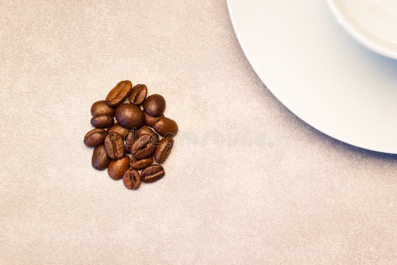 A Small Heap of Roasted Coffee Beans Laying Close To the Side of an ...