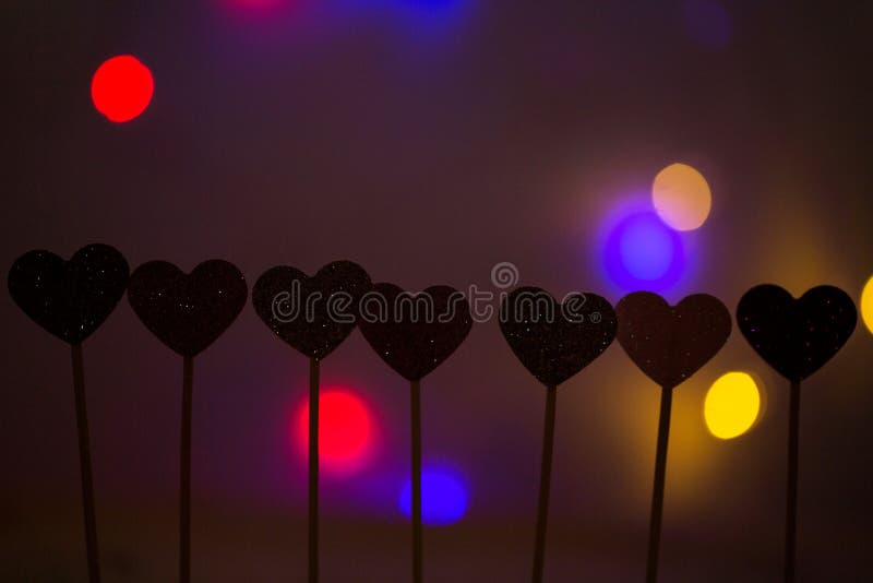 Small Hearts in a Row, Lights in the Background Stock Photo - Image of ...