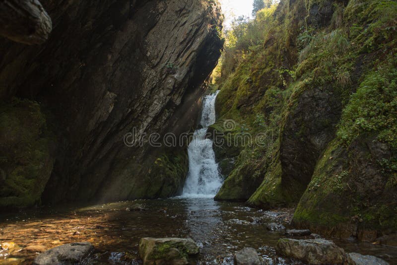 Small Hidden Waterfall in the Forest in the Cleft of the Rock Stock ...