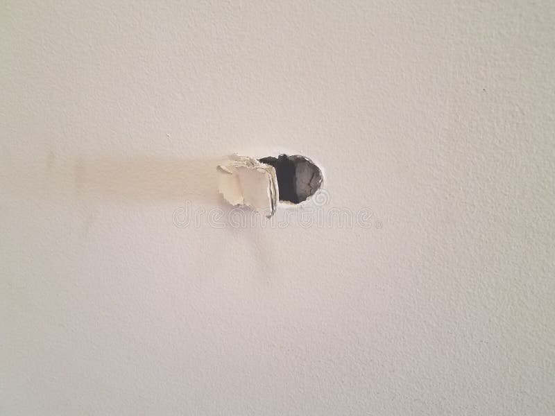 Small Hole Damage in a Drywall Wall Stock Image - Image of repair ...
