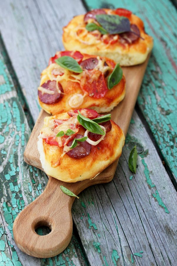 Small homemade pizza stock photo. Image of salami, people - 56927262
