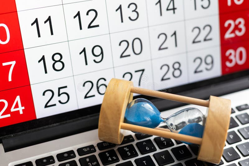 Small Hourglass Stands on the Calendar, Counting the Time. the Concept ...