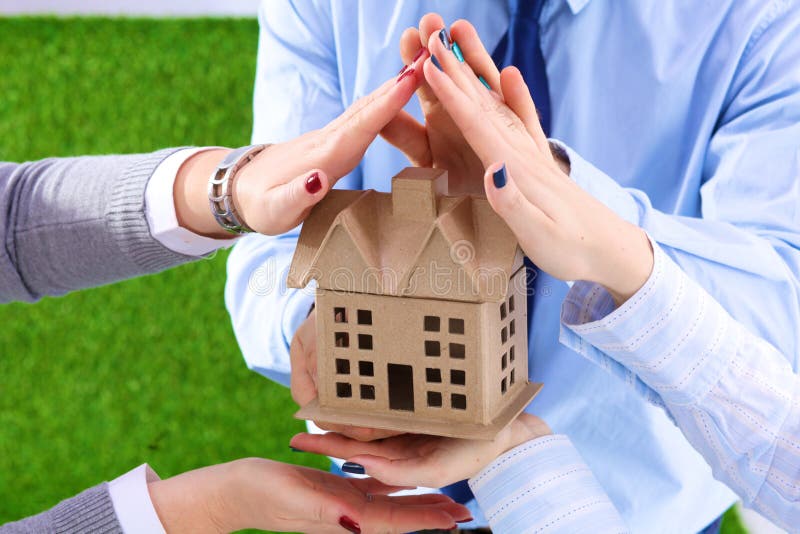 A Small House in the Hands. Big Plans for the Future Stock Photo ...