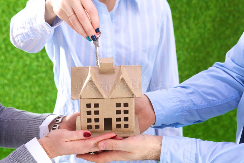 A Small House in the Hands. Big Plans for the Future Stock Photo ...