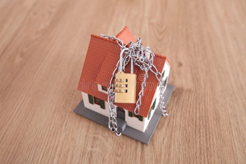 Small House Model is Locked Stock Photo - Image of chain, asset: 197010528