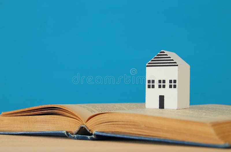 Small House Model Over Open Book. Selective Focus Stock Photo - Image ...