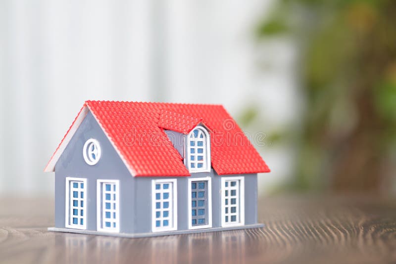 A Small House Model on Table Stock Image - Image of holding, still ...